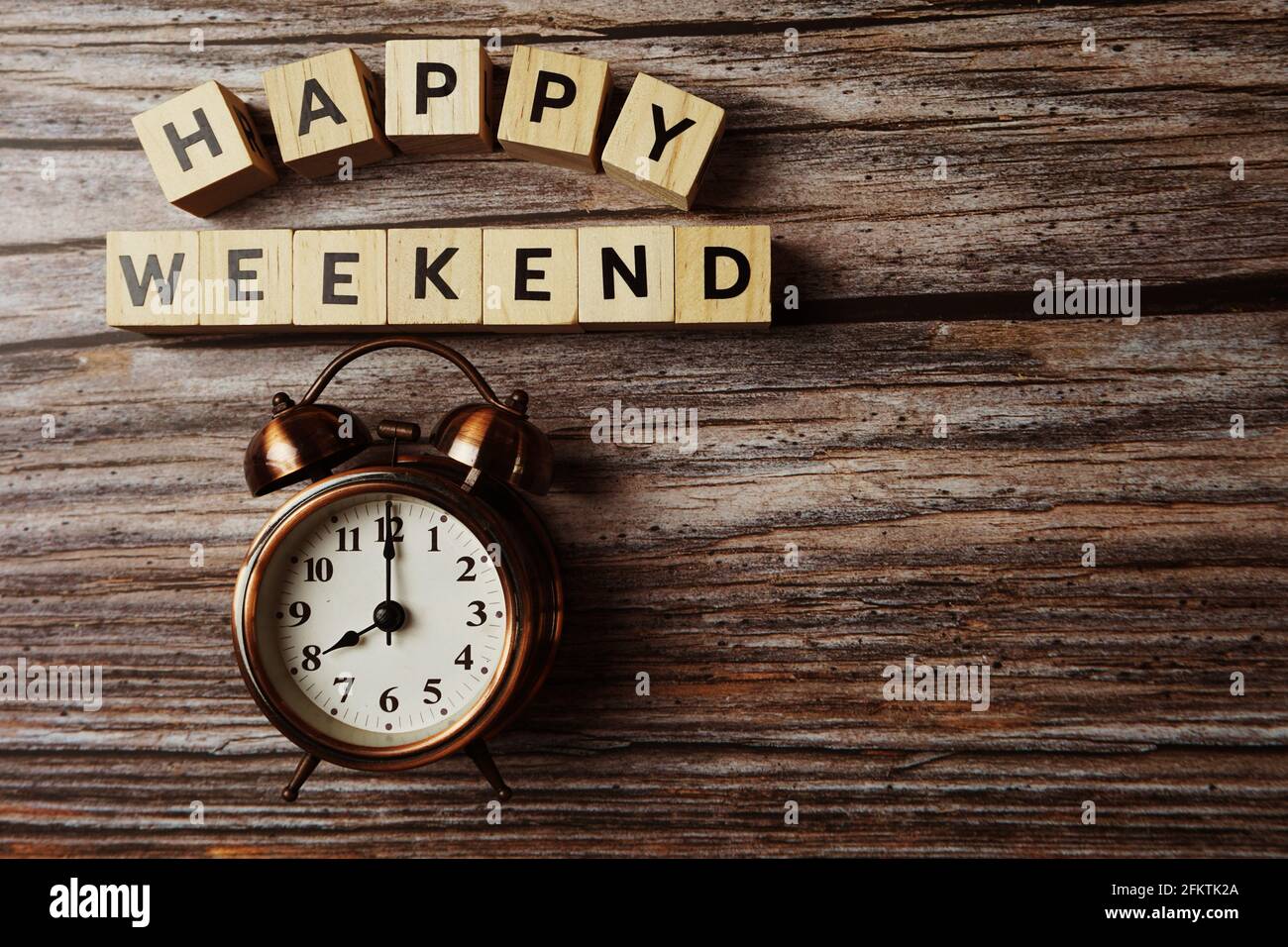 Happy Weekend alphabet letter with alarm clock on wooden background ...
