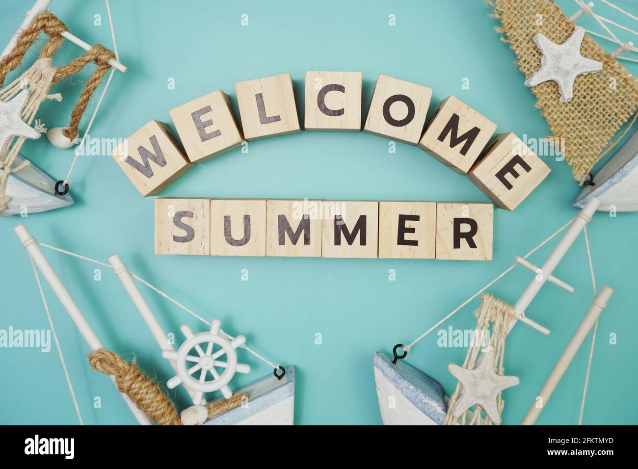 Welcome Summer message alphabet letter with sailboat on blue background ...