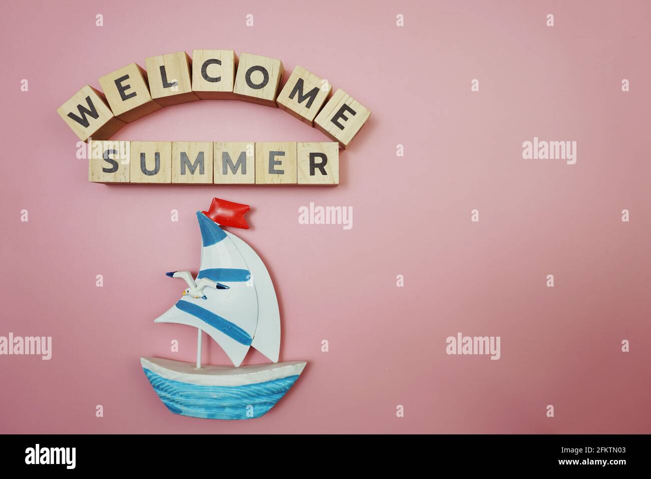 Welcome Summer message alphabet letter with sailboat on pink background ...