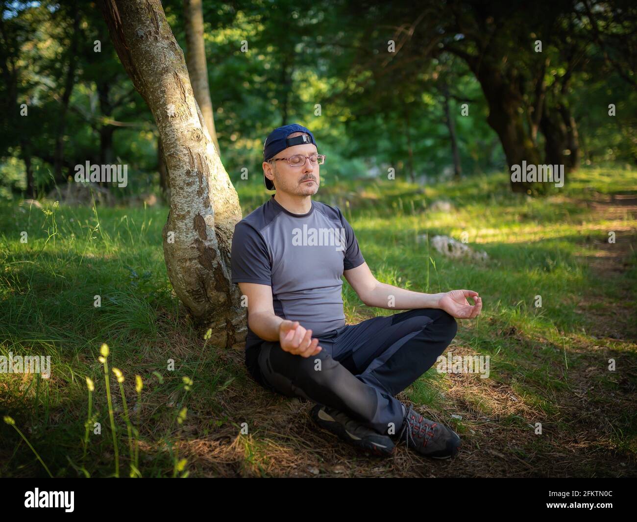 Man sitting in woods hi-res stock photography and images - Alamy