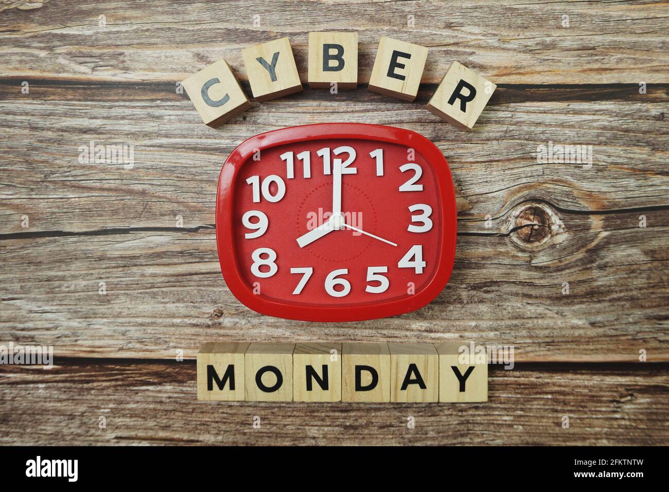 Cyber Monday alphabet letters with alarm clock top view on wooden ...
