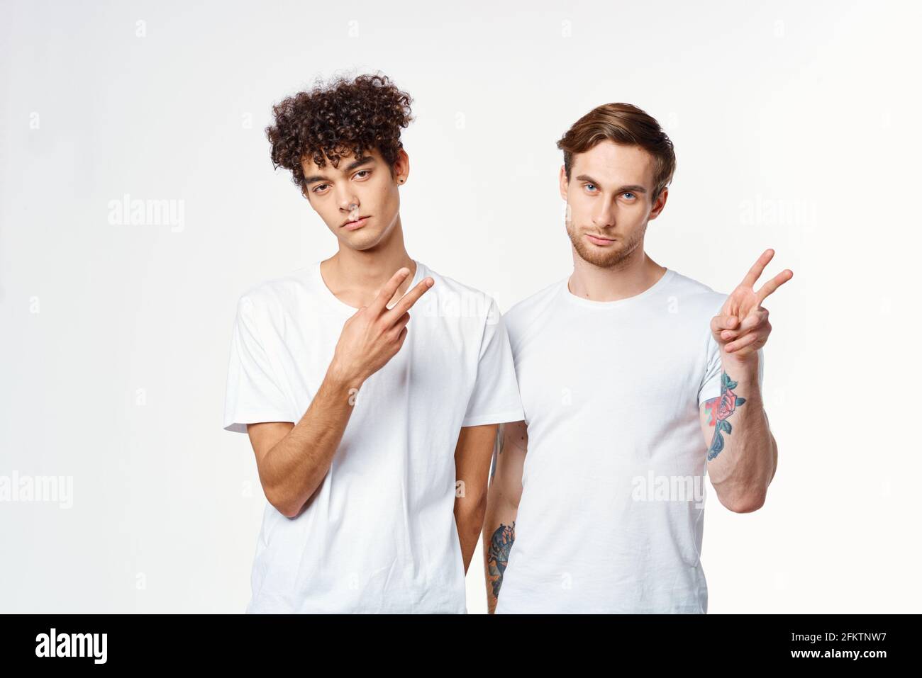 Portrait two brothers standing back hi-res stock photography and images ...