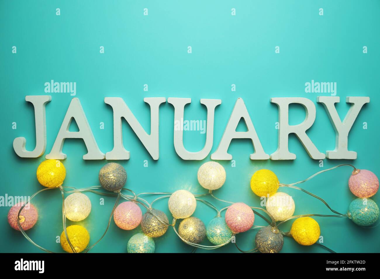 January alphabet letter with cotton ball LED decoration on blue ...