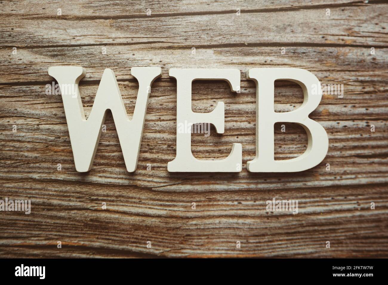 WEB alphabet letter on wooden background Stock Photo - Alamy