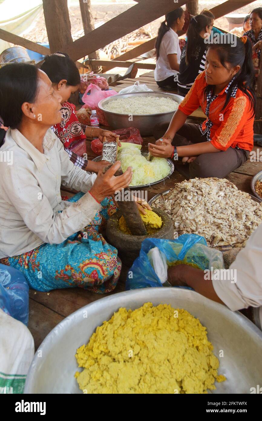 Woman prepare food for the monks at kampong Phulk, tonle sap lake, siem ...