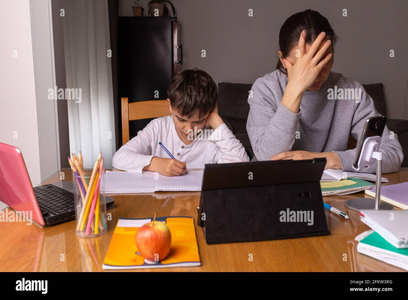 boy doing his homework while lock down, studying remotely Stock Photo ...