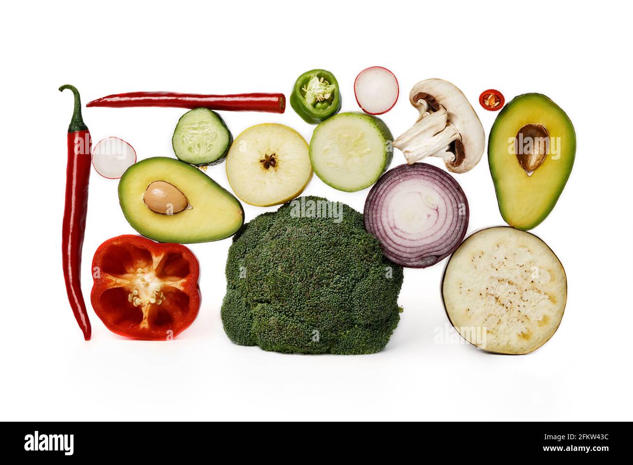 Sliced ??vegetables layout on a white background frontal view Stock ...