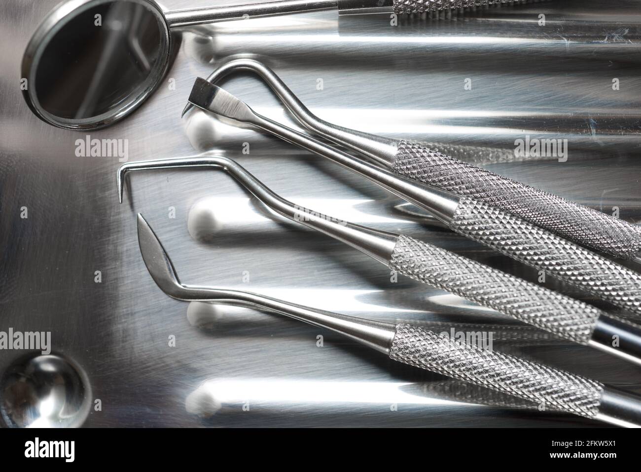 Instruments used by the dentist on a metal tray Stock Photo - Alamy