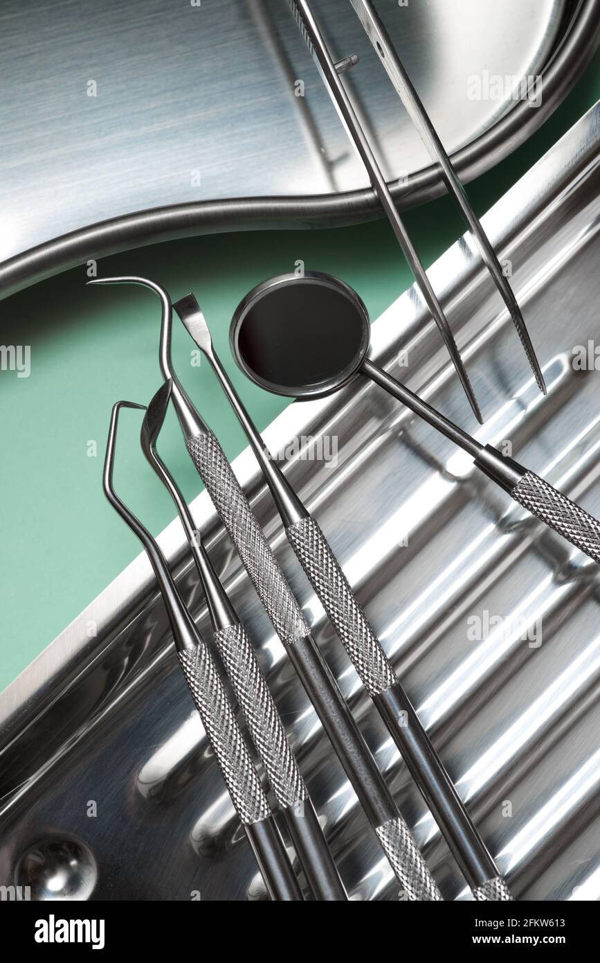 Instruments used by the dentist on a metal tray Stock Photo - Alamy