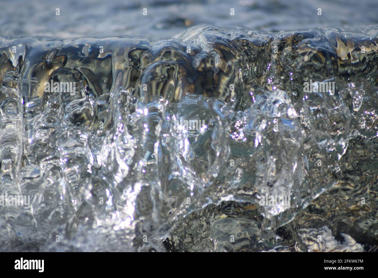 Ripples of Small Breaking Wave Stock Photo - Alamy