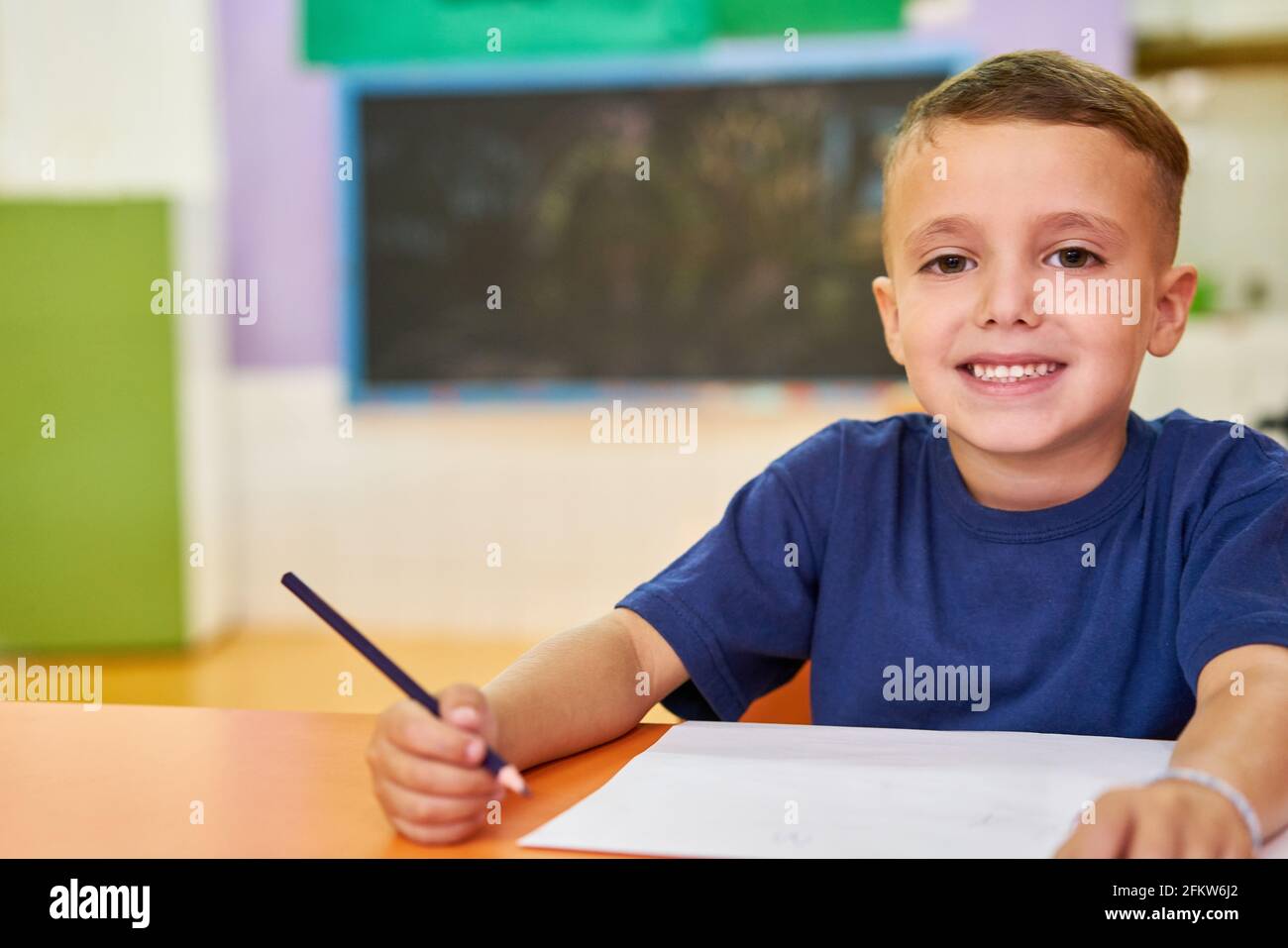 Portrait happy school children drawing hi-res stock photography and ...