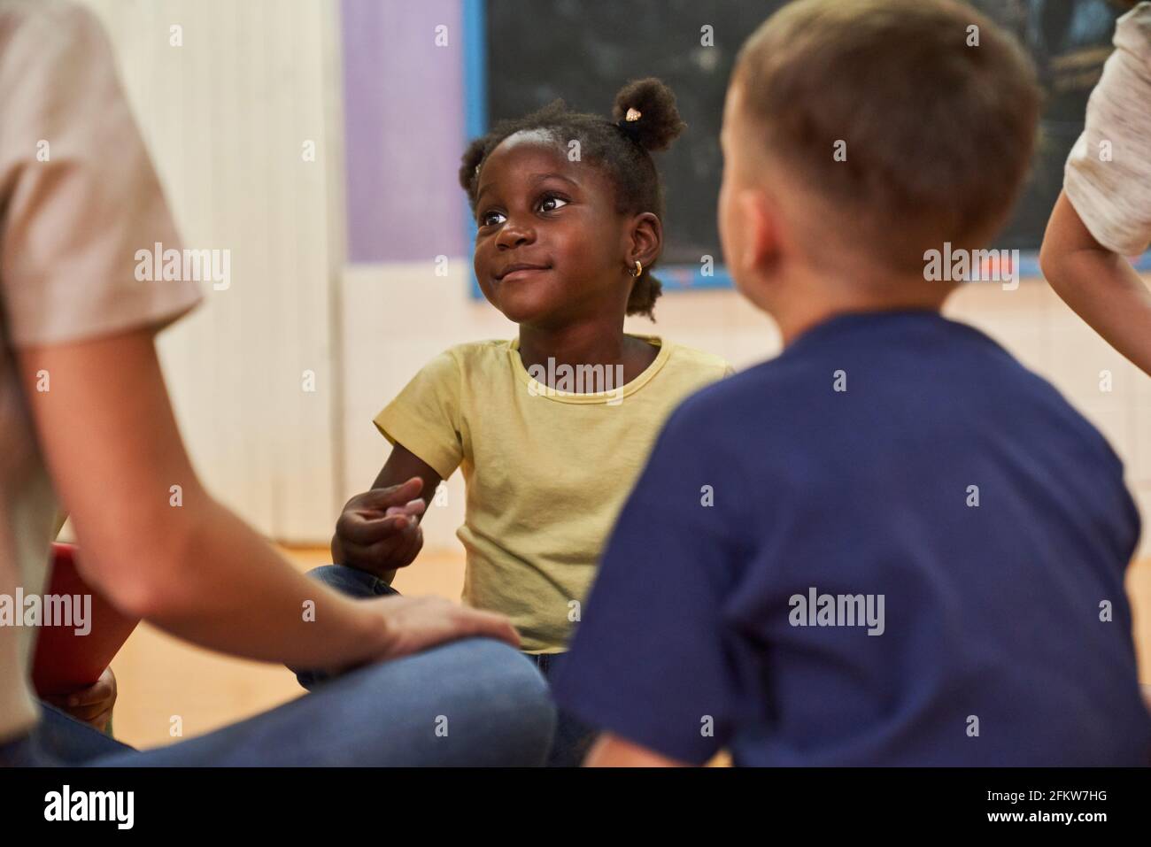 African girl plays in international kindergarten for integration ...