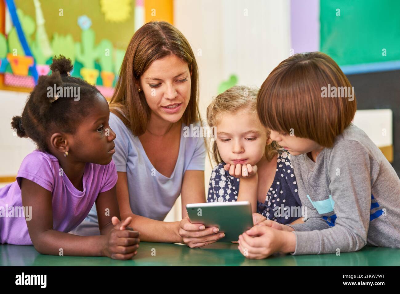Group happy children tablet hi-res stock photography and images - Alamy