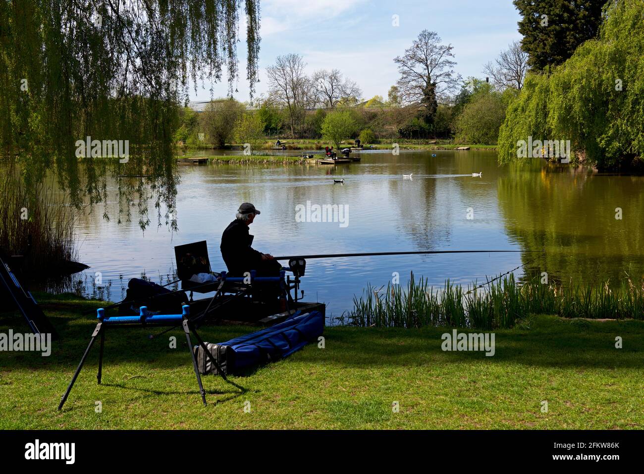 Angler at the Delves fishing lake, Thorne, South Yorkshire, England UK ...