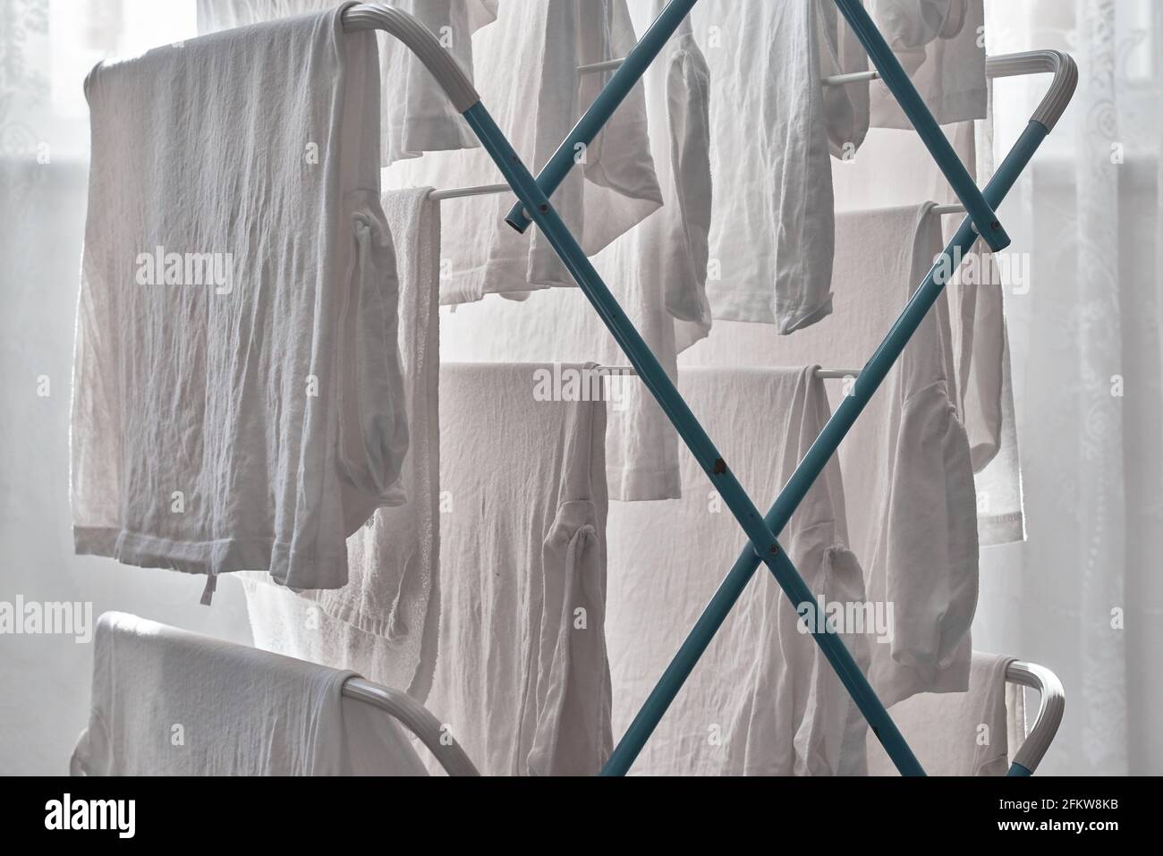 Clothes hanging on the drying rack hi-res stock photography and images ...