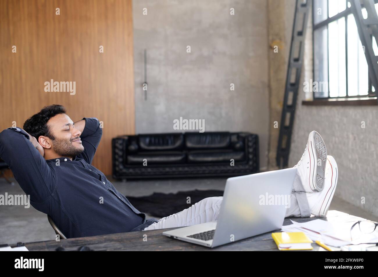 Satisfied and calm hindu mixed-race businessman takes a break on the ...