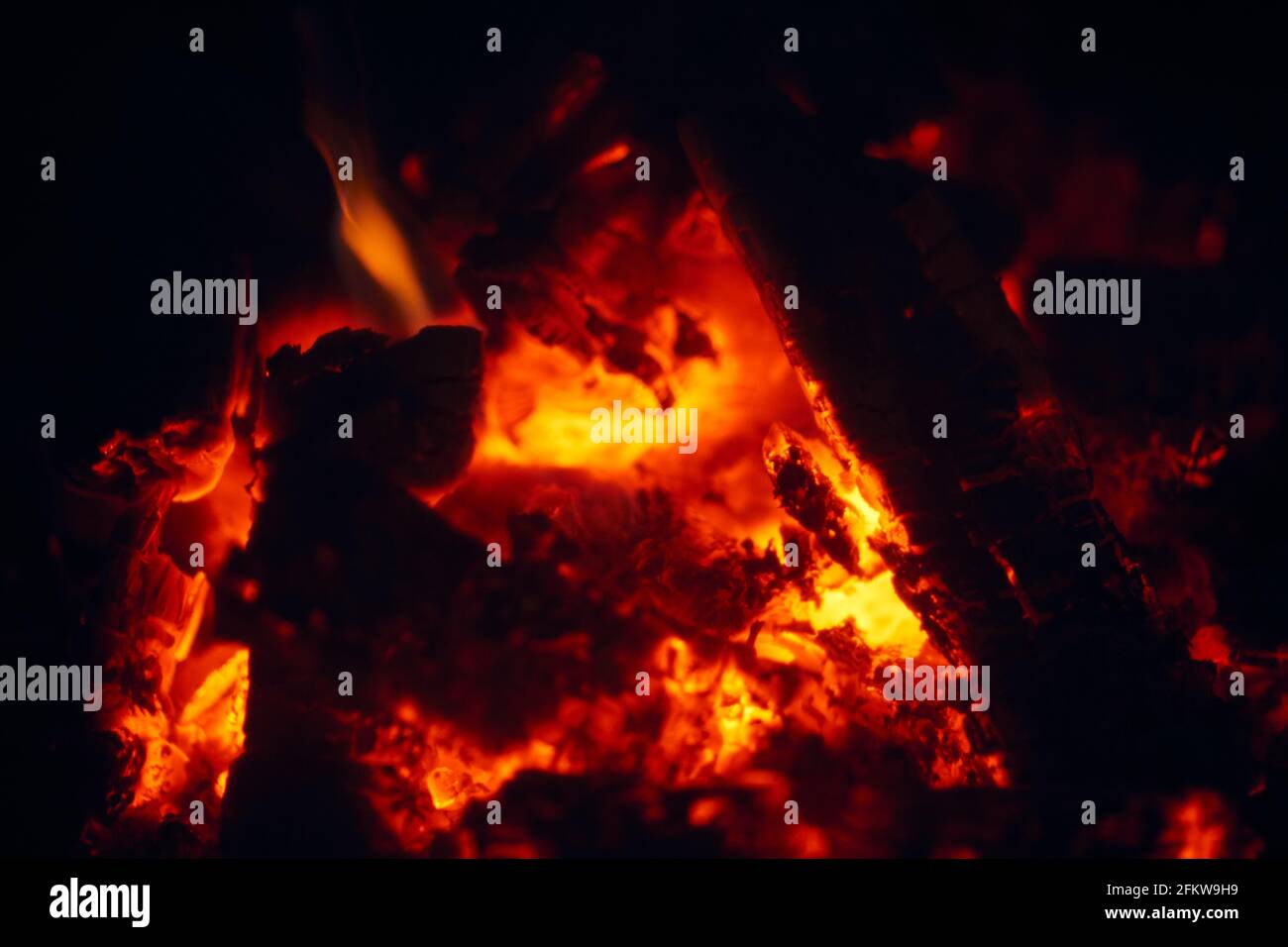 A fire burns in a fireplace, Fire to keep warm. Logs burning in a ...