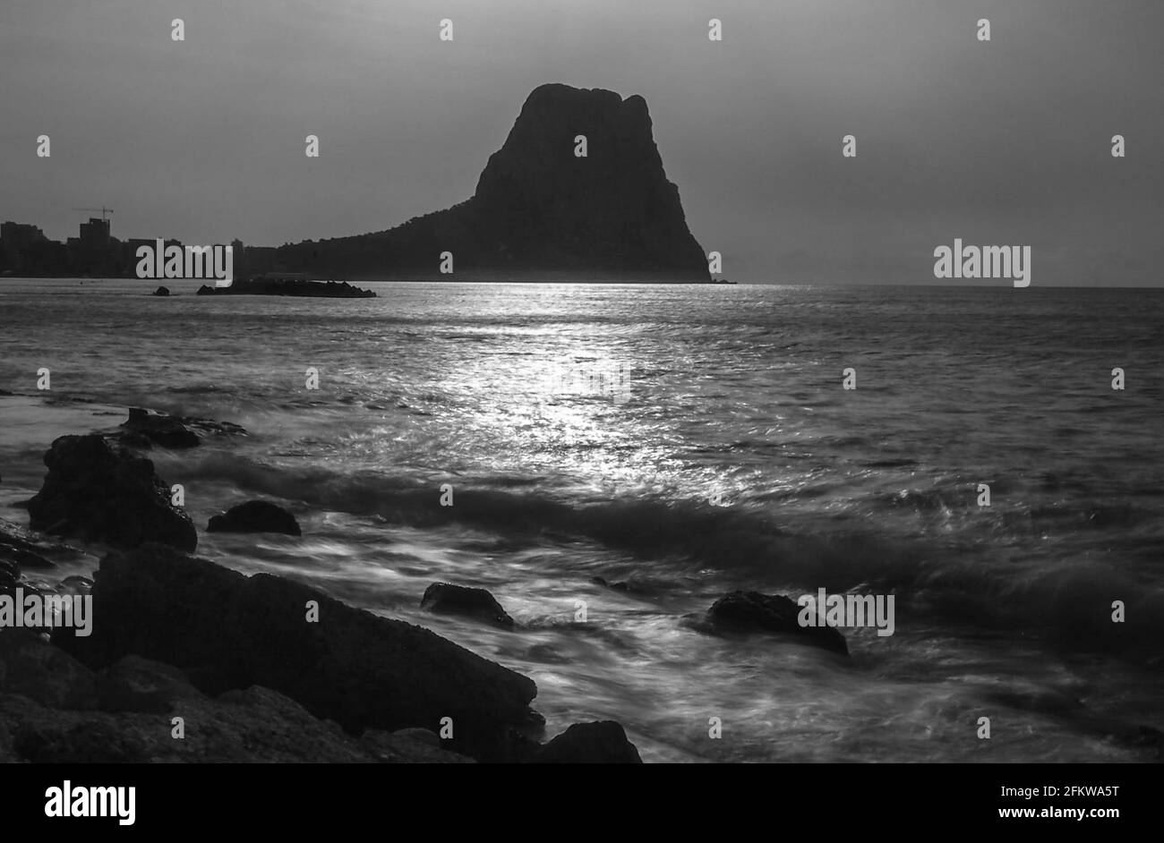 Grayscale shot of a sea at sunset Stock Photo - Alamy
