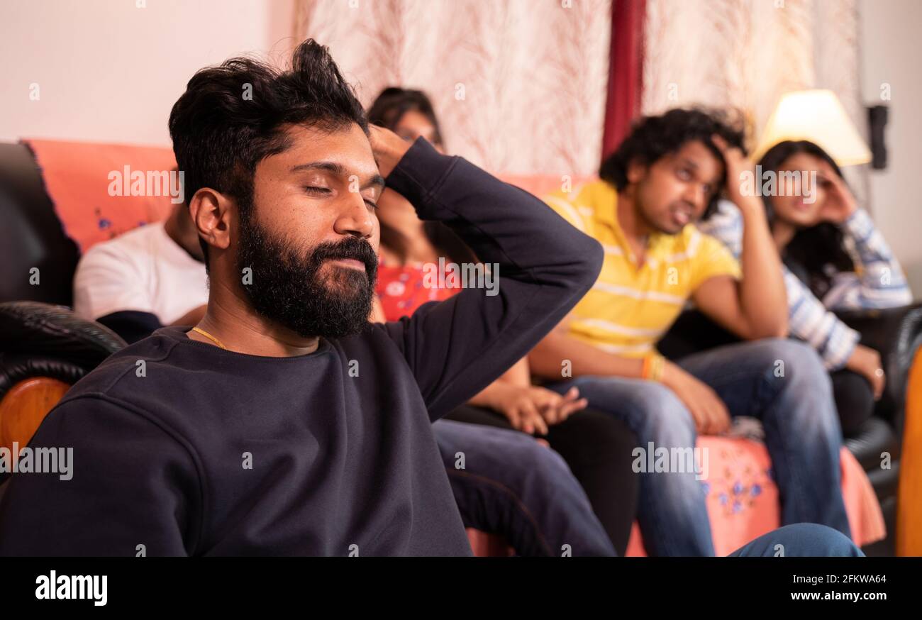 Close up of focus on young disappointed man, Group of young sports fans ...