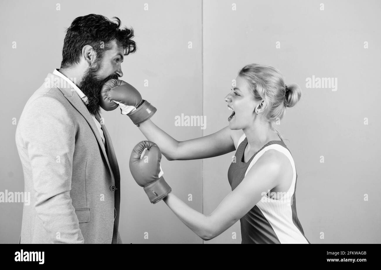 Strong punch. Boxers fighting in gloves. Gender equality. Man and woman ...