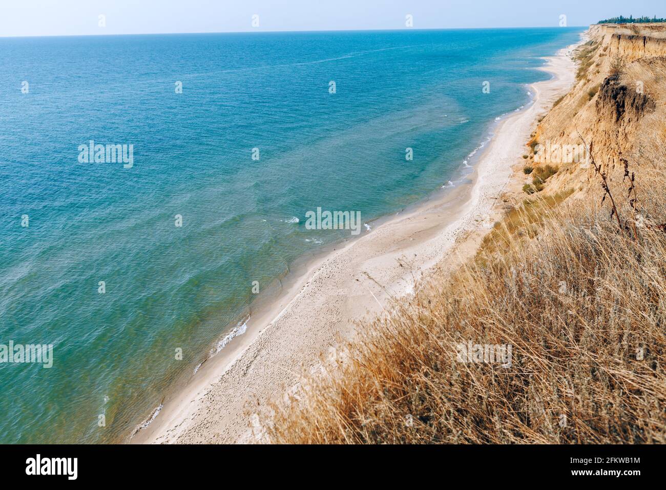 Coastal Clay Cliff and Sandy Beach . Craggy coastline and sunny beach ...