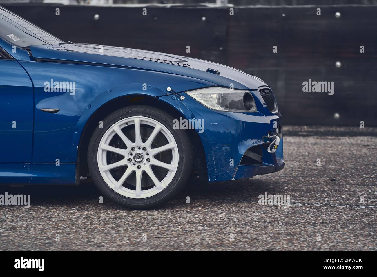 Front side view of black car driving fast Stock Photo - Alamy