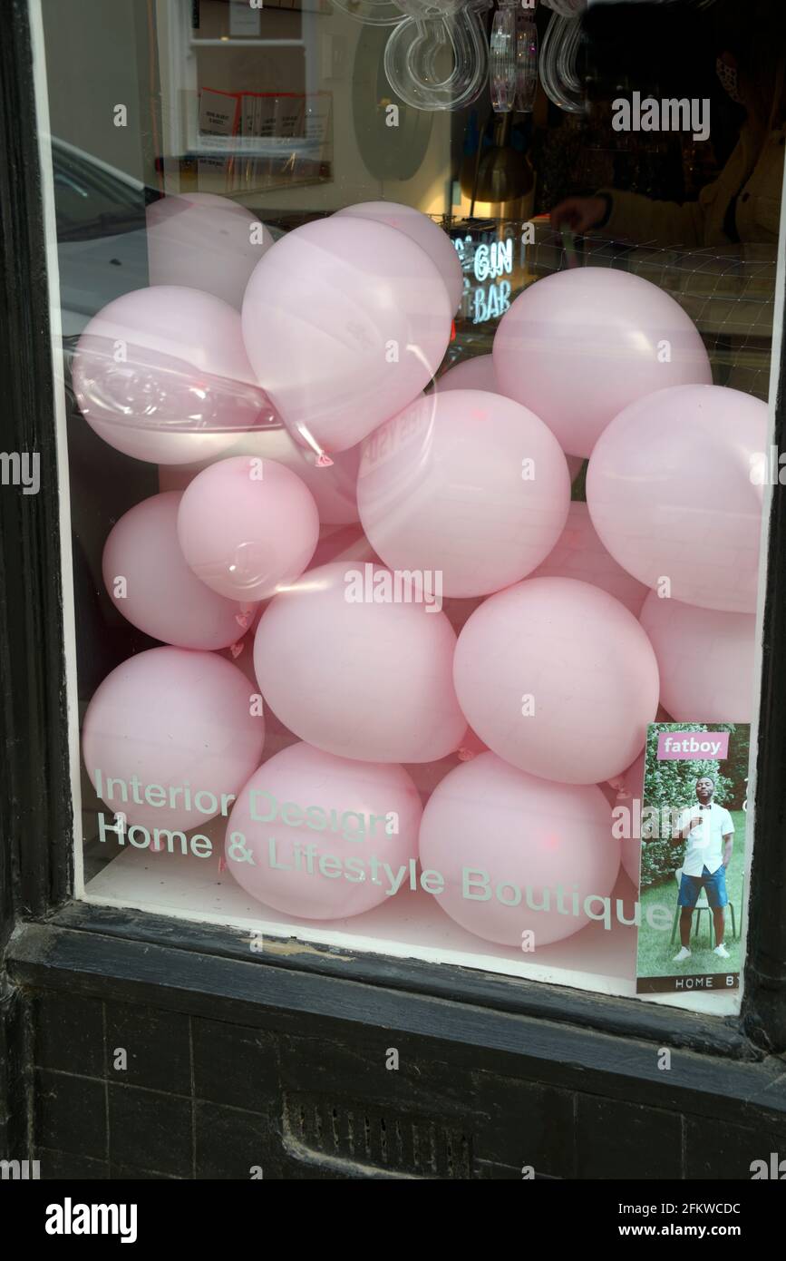 Shop window, full of pink balloons Stock Photo - Alamy