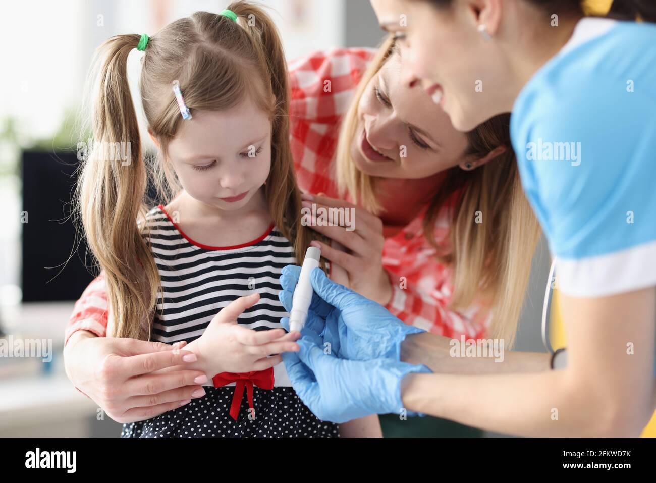 Little girl has doctor taking blood test with lancet Stock Photo - Alamy