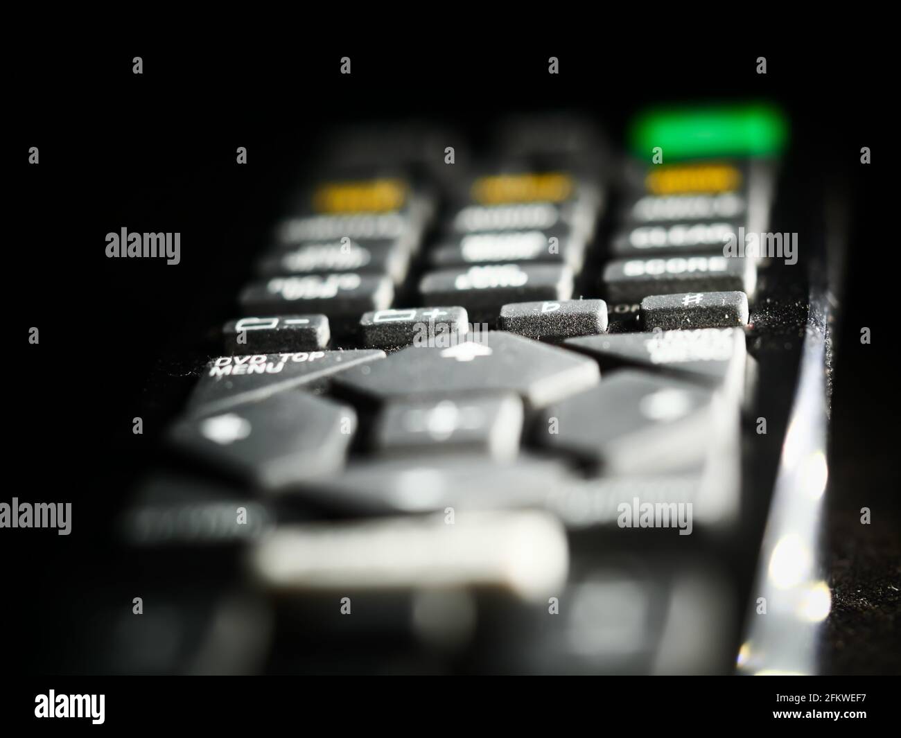 Selective focus shot of remote control with different buttons for the ...