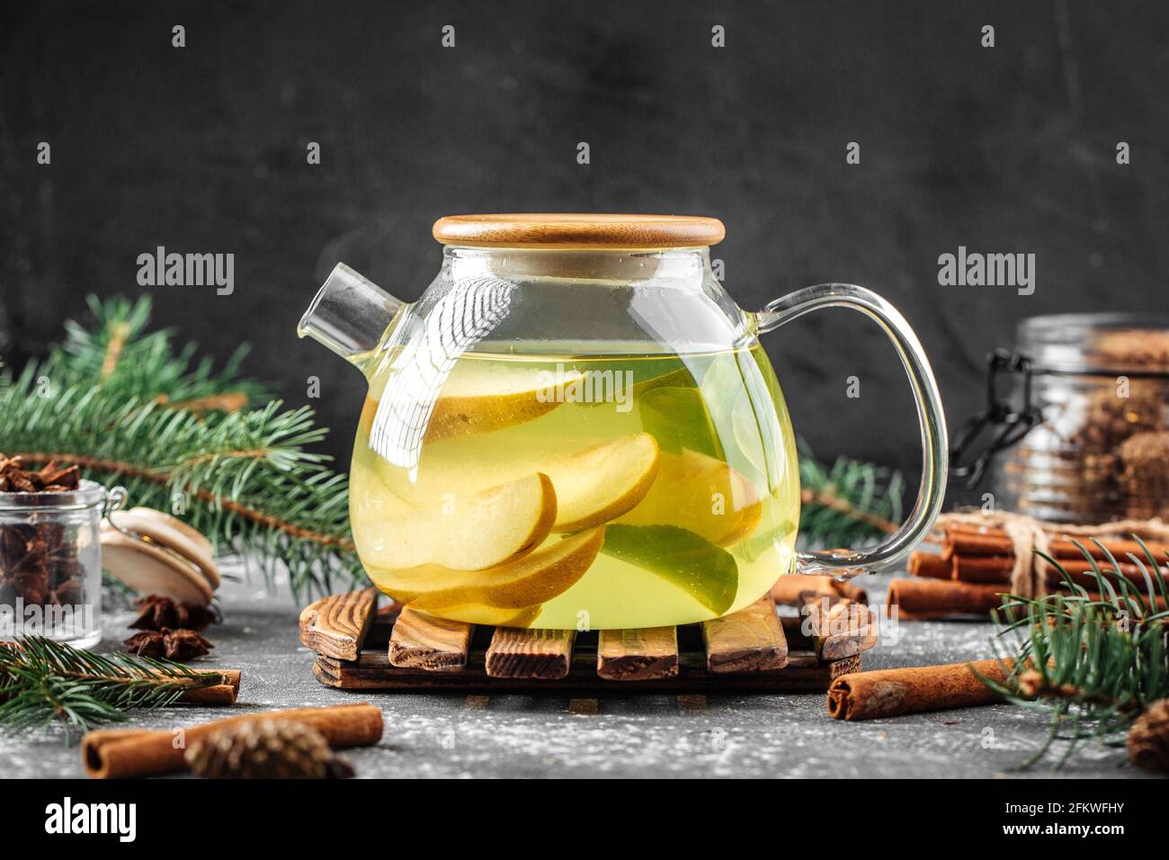 Glass kettle of fresh pear herbal tea Stock Photo - Alamy