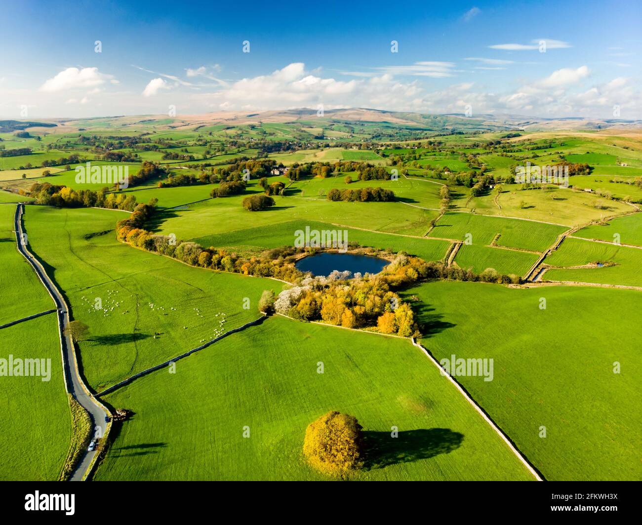 Aerial view of endless lush pastures and farmlands of England ...
