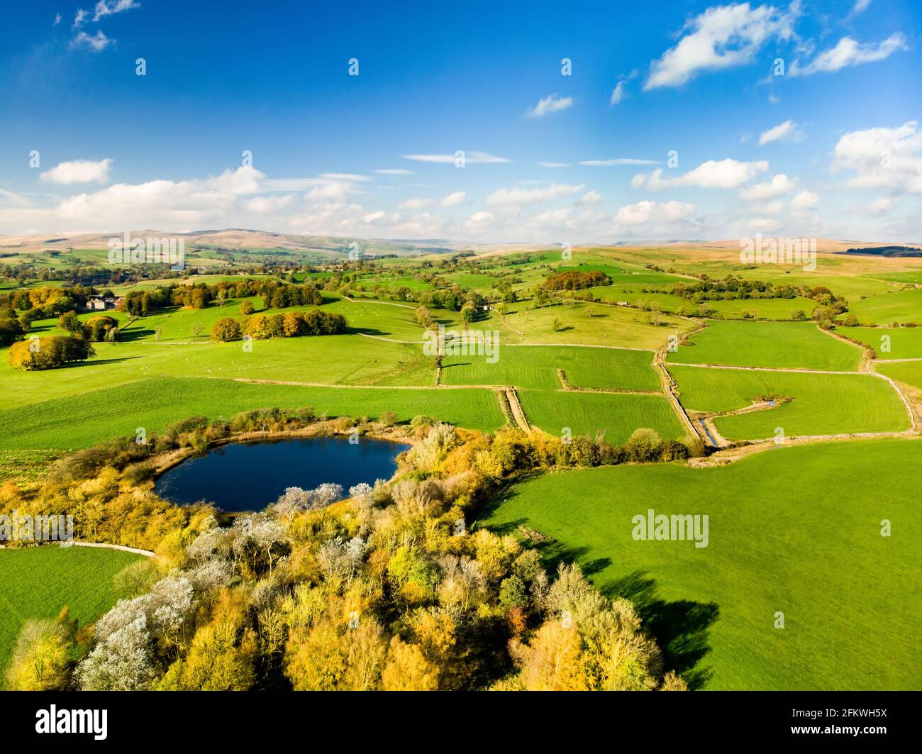 Aerial view of endless lush pastures and farmlands of England ...