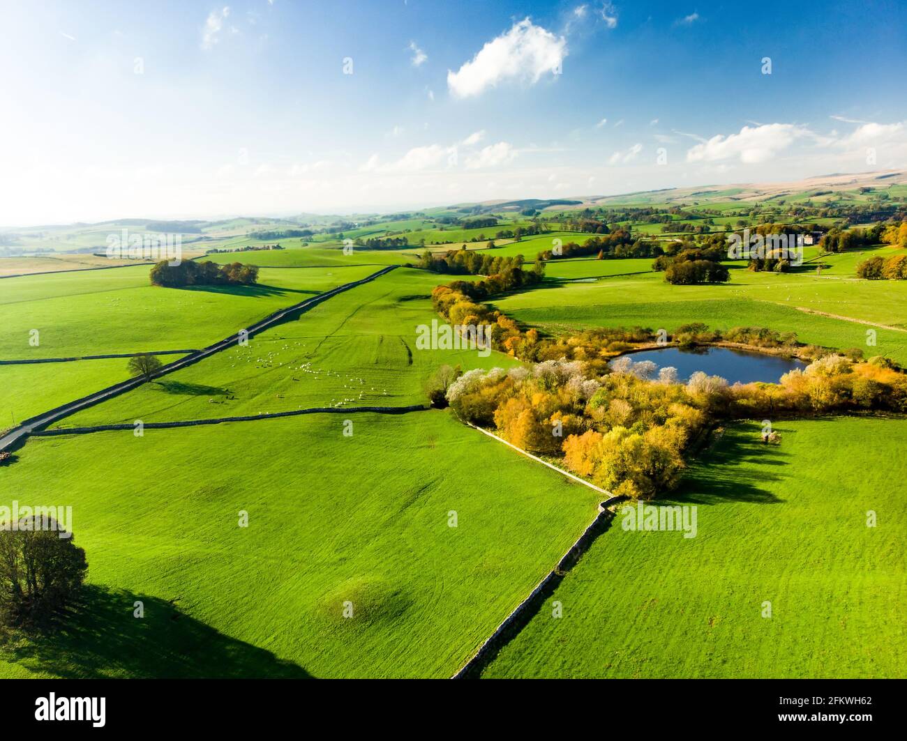 Aerial view of endless lush pastures and farmlands of England ...