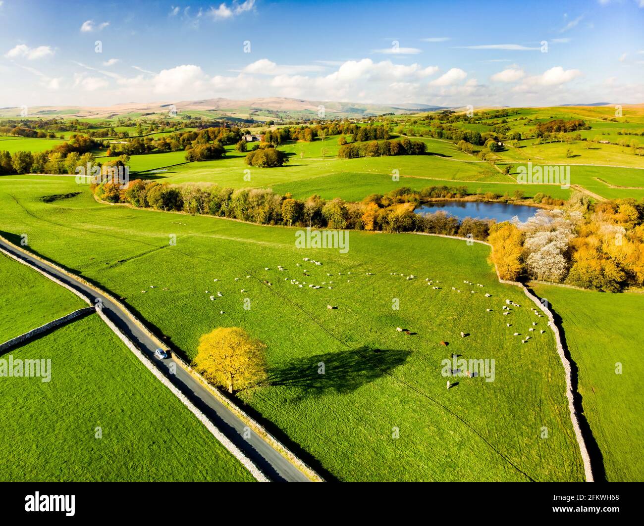 Aerial view of endless lush pastures and farmlands of England ...