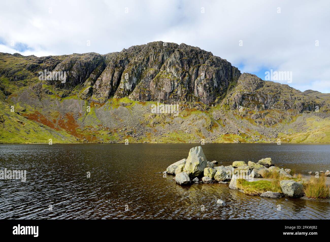 Clear waters of Stickle Tarn lake, located in the Lake District ...