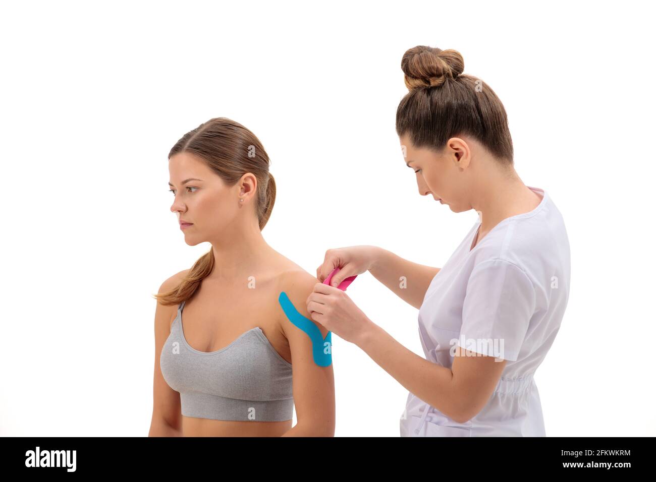dynamic functional bandage with taping. female specialist glues kinesio ...