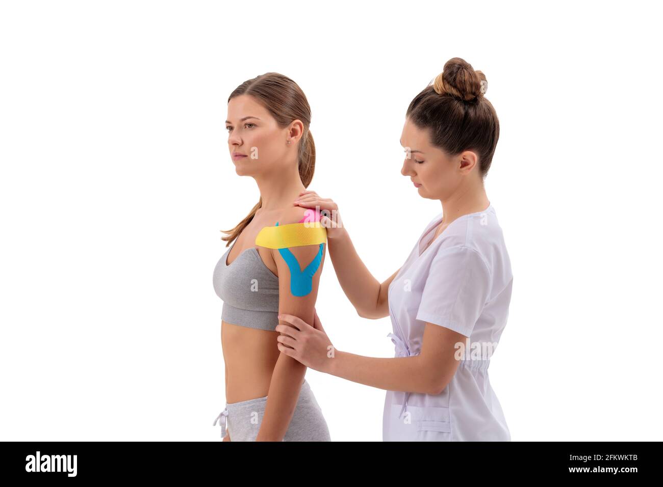 dynamic functional bandage with taping. female specialist glues kinesio ...