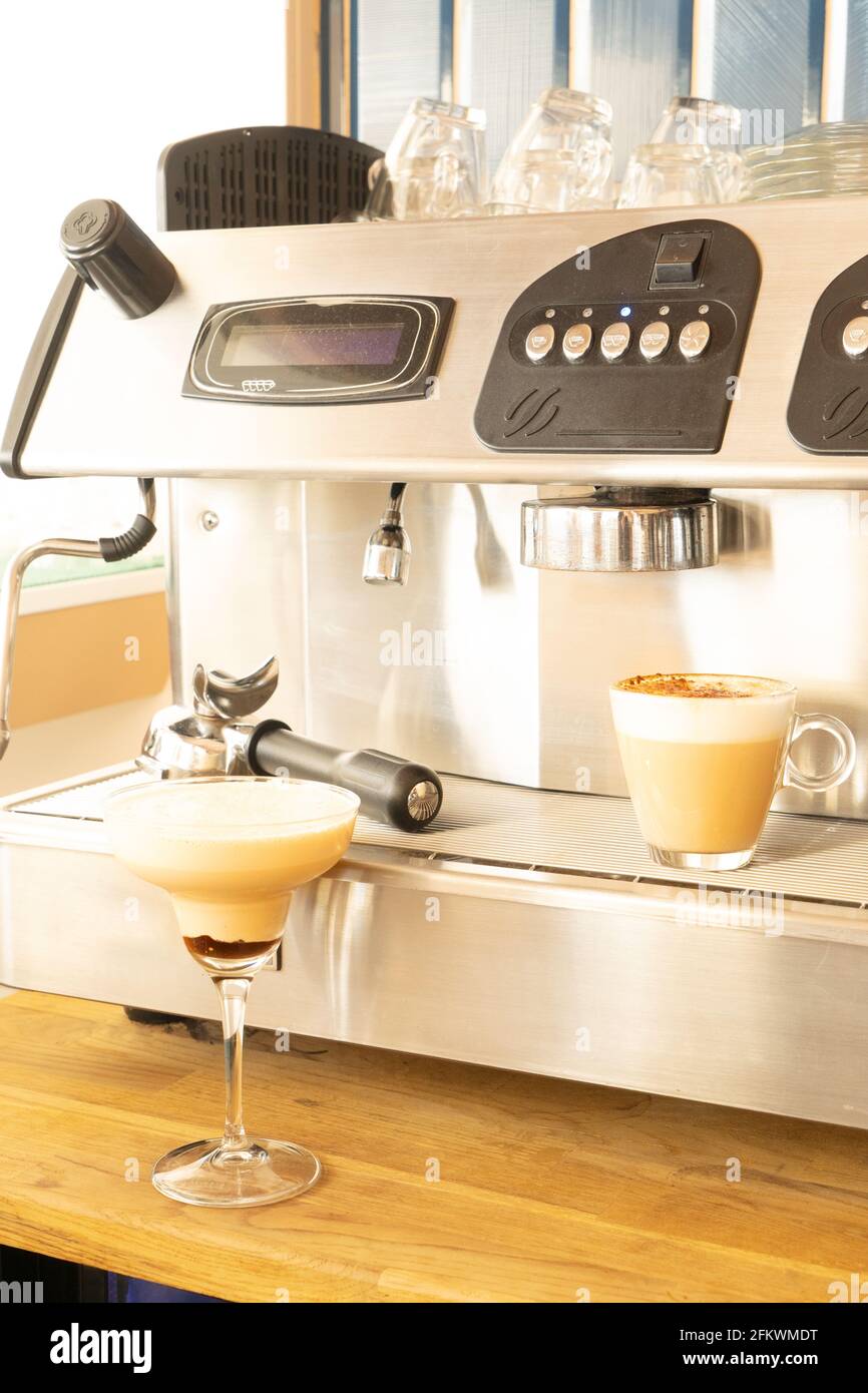 Coffee drinks near professional coffee machine on restaurant bar ...