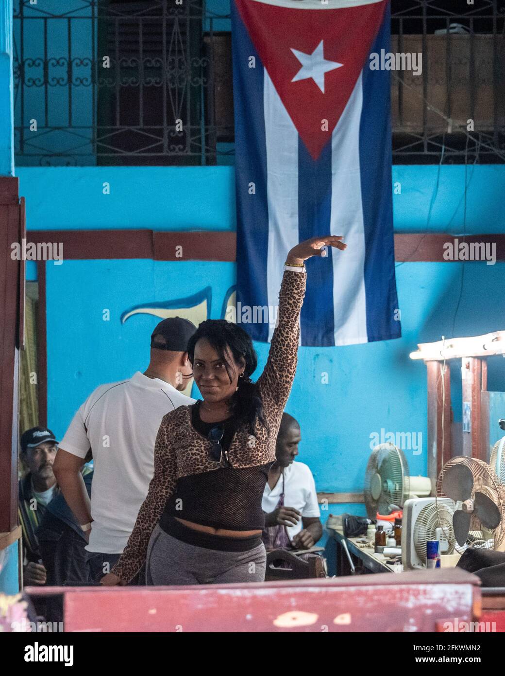 Afro Caribbean woman employee of a repair shop posing for the ...