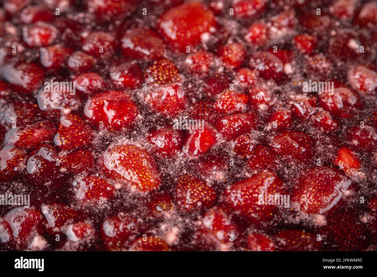 Strawberry jam is boiling, detailed shooting. Close-up of strawberry ...