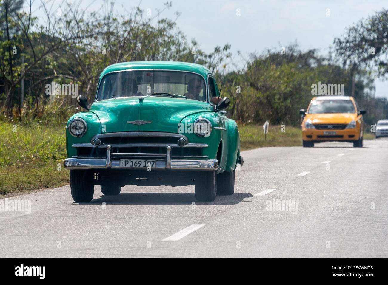 Cuban vintage American cars driving, Cuba transportation scene in the ...