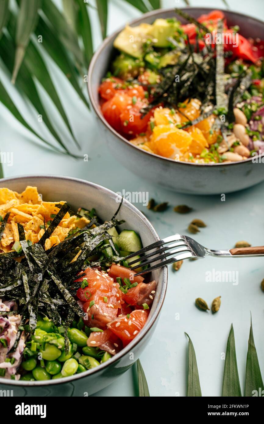 Two bowls of hawaiian healthy poke mixes Stock Photo - Alamy