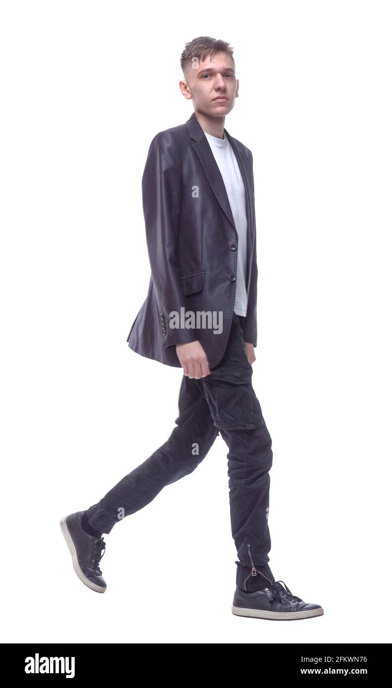 in full growth. serious guy confidently striding forward Stock Photo ...
