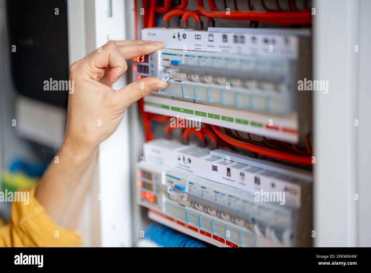 Woman turning off digital hi-res stock photography and images - Alamy