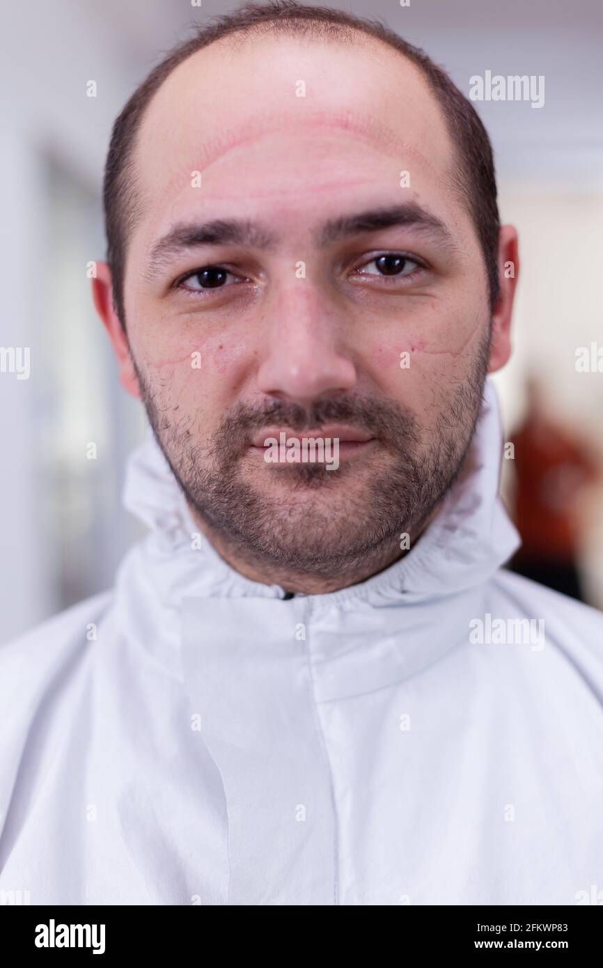 Doctor in safety coverall looking hi-res stock photography and images ...