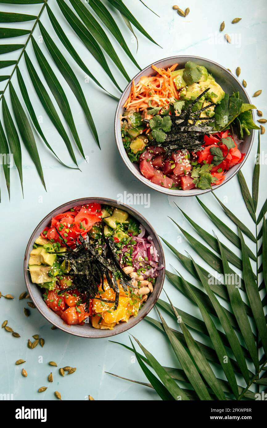 Two bowls of hawaiian healthy poke mixes Stock Photo - Alamy
