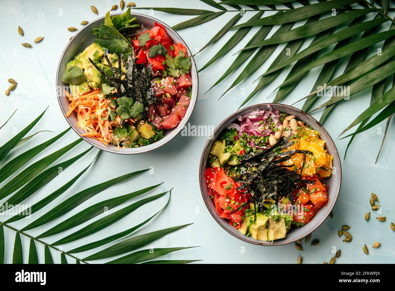 Two bowls of hawaiian healthy poke mixes Stock Photo - Alamy