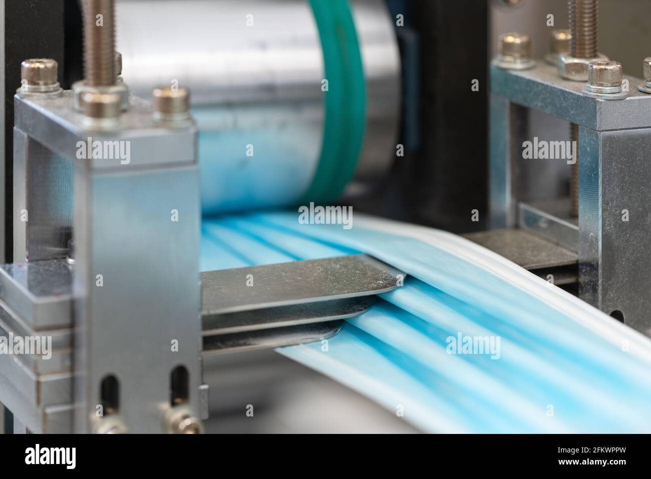 Closeup process of medical face masks being made in a factory ...