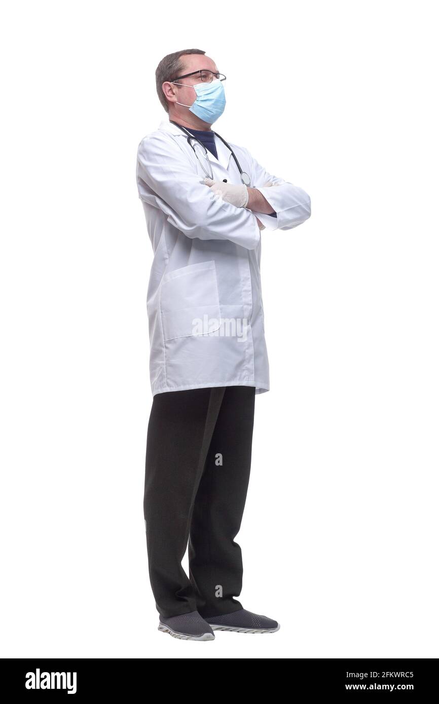 side view. doctor in a protective mask looking at a white blank screen ...