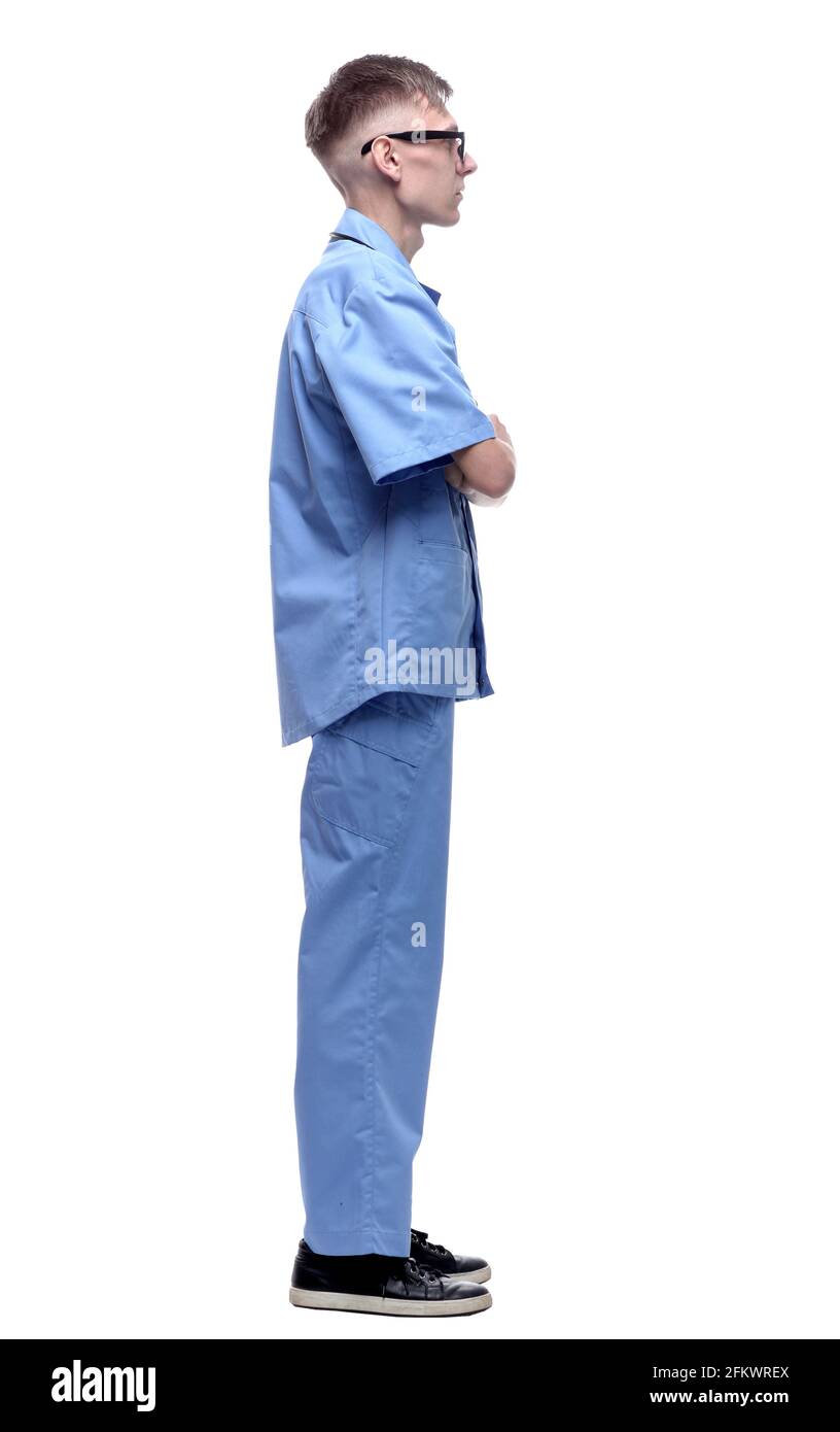 side view. serious paramedic with a stethoscope looking at a white ...